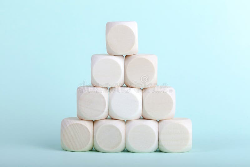 Simple Pyramid Made of Small Empty Blank Wooden Blocks, Cubes on Light ...