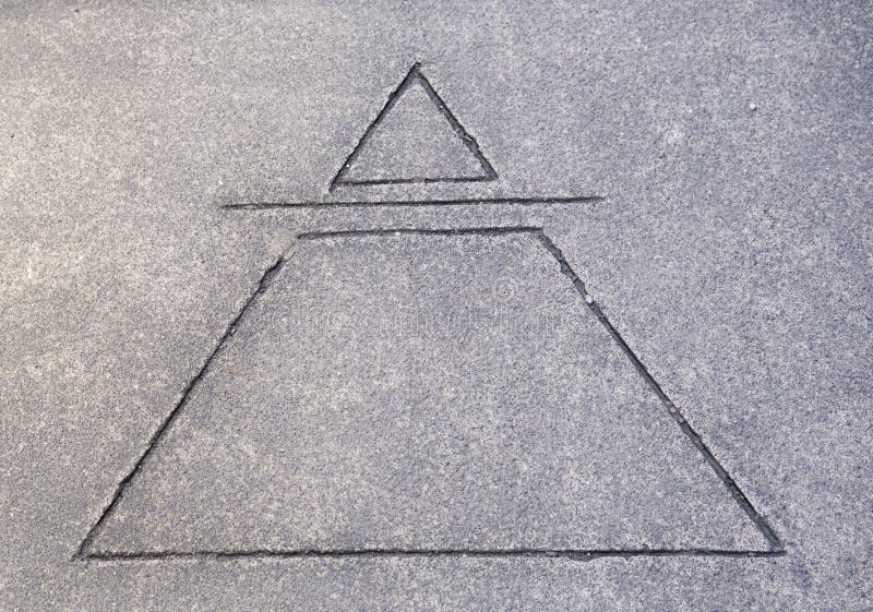 Simple Pyramid and Triangle Symbol Imprinted in Concrete Pavement ...