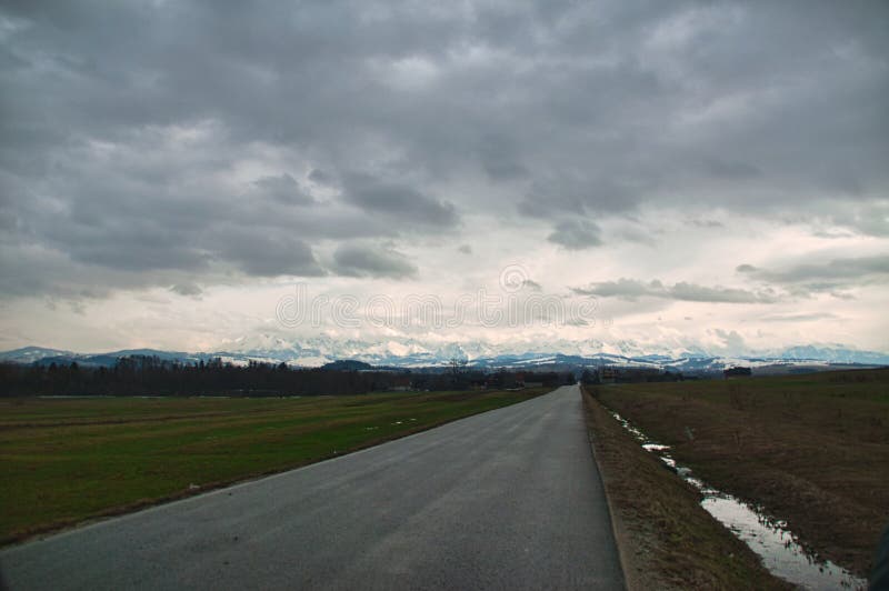 A Simple Road Leading Straight into the Tatra Mountains in Winter Empty ...