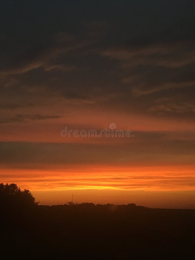 Simple Setting Sun Over a Valley Stock Image - Image of setting ...