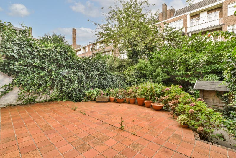 Simple Patio with Vegetation Inside Stock Image - Image of table, stone ...