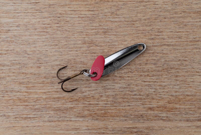 Simple Spoon Type Fishing Lure with a Treble Hook Stock Photo - Image ...