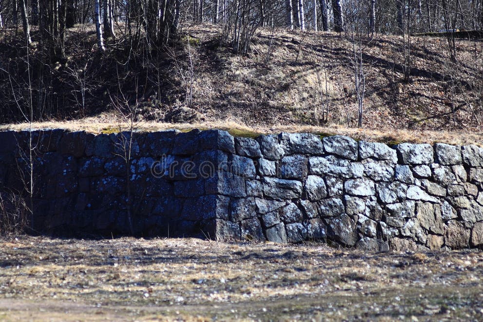 A Simple Stone Wall Dividing an Open Grassy Field Stock Image - Image ...