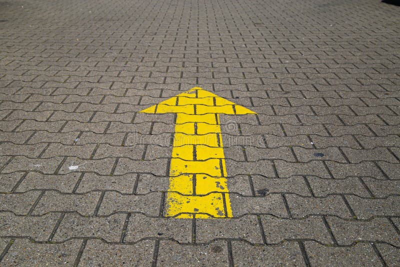 Simple Straightforward Solution Concept: Yellow Arrow an Paving Blocks ...