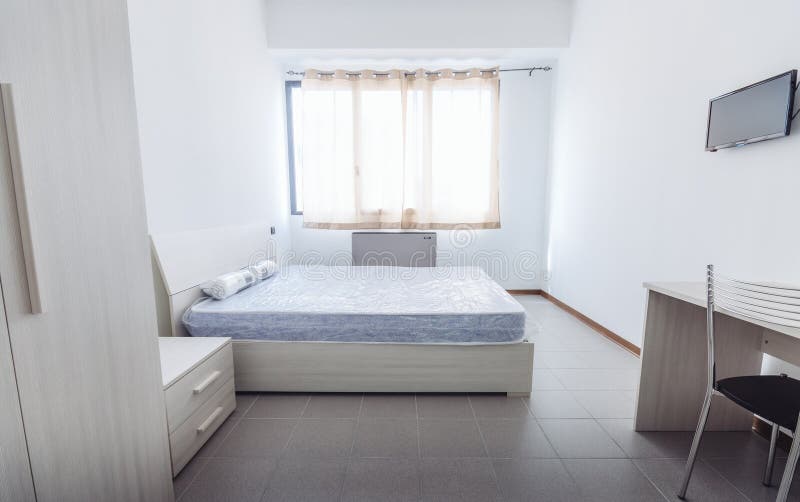 Simple Student-style Dorm Bedroom with Lots of Light Stock Image ...