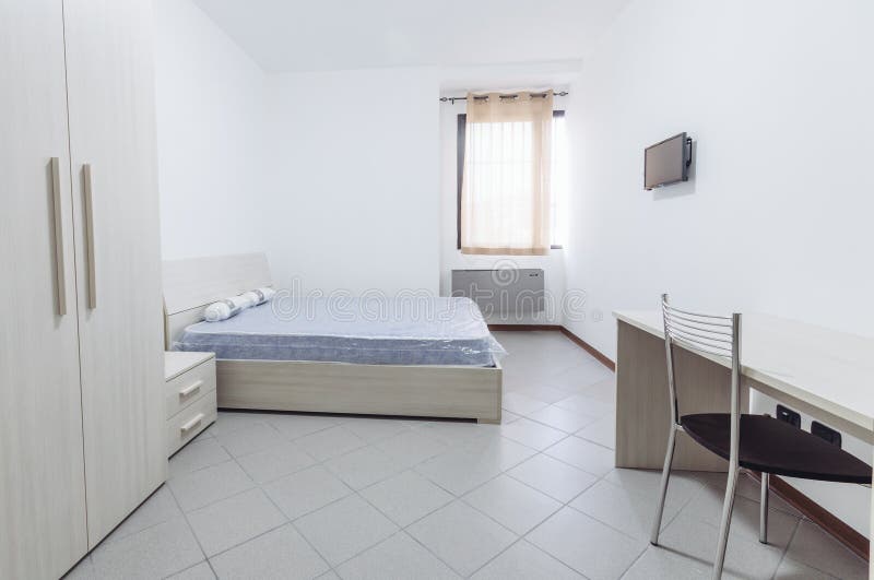 Simple Student-style Dorm Bedroom with Lots of Light Stock Image ...