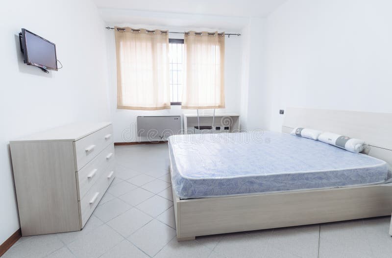 Simple Student-style Dorm Bedroom with Lots of Light Stock Image ...