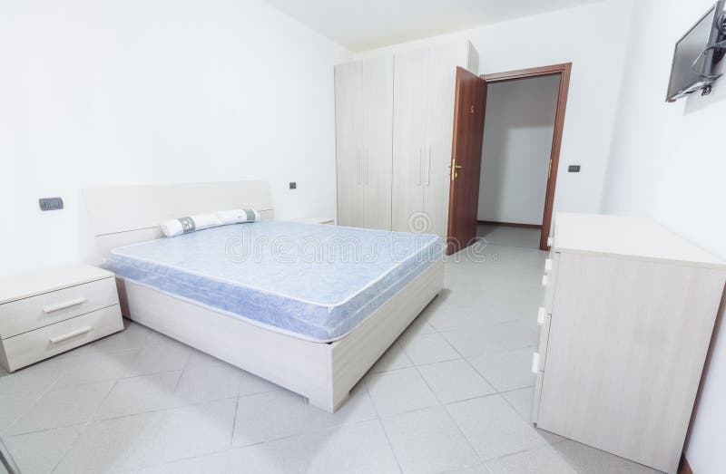 Simple Student-style Dorm Bedroom with Lots of Light Stock Photo ...