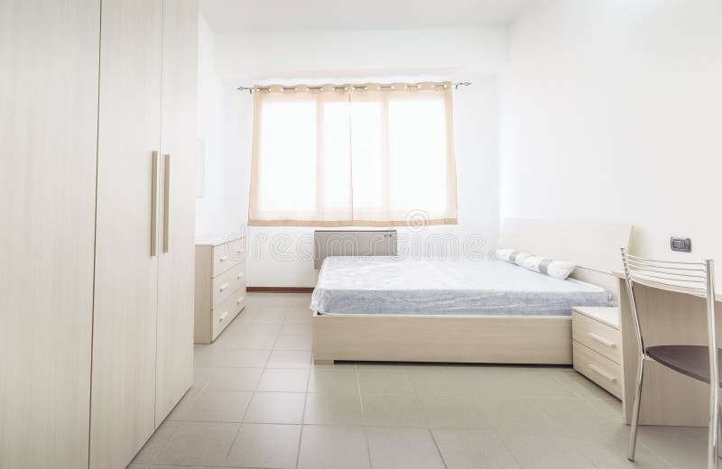 Simple Student-style Dorm Bedroom with Lots of Light Stock Image ...