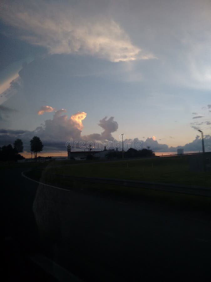 Simple Sunset with Different Clouds and Sky Colors Stock Photo - Image ...