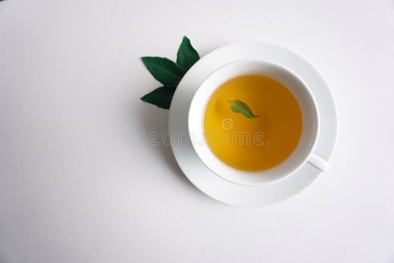 Simple Teacup with Tea and Leaves Stock Image - Image of background ...