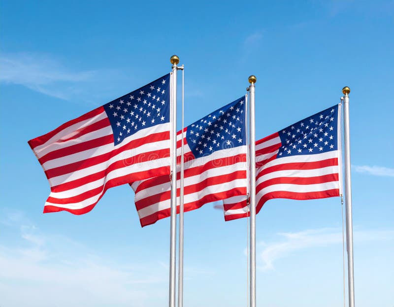 A Simple Trio of Stars and Stripes Flags Blowing in the Wind Against a ...