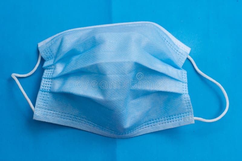 A Simple Used Surgical Mask with a Colourful Background Stock Image ...