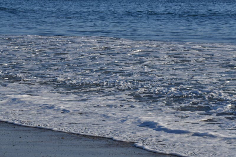 Simple View of the Pacific Ocean Tide As it Meets the Sand Stock Photo ...