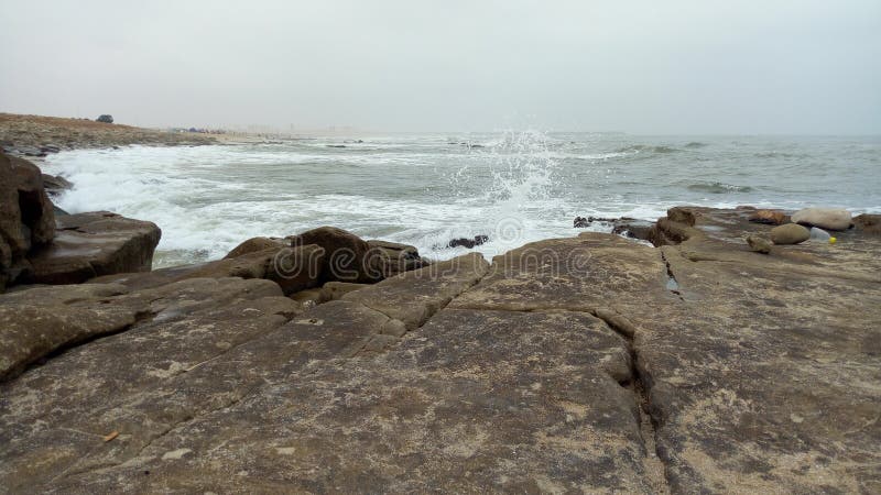 A Simple View of the Waves Breaking on the Smooth Rocks Stock Photo ...