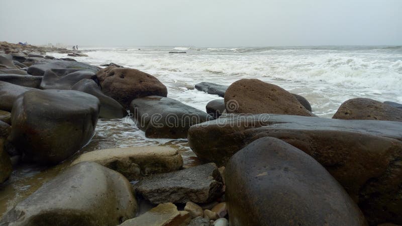 A Simple View of the Waves Breaking on the Smooth Rocks Stock Image ...