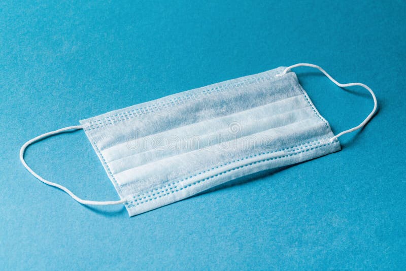 Simple White Air Protection Mask on Blue Background Stock Image - Image ...