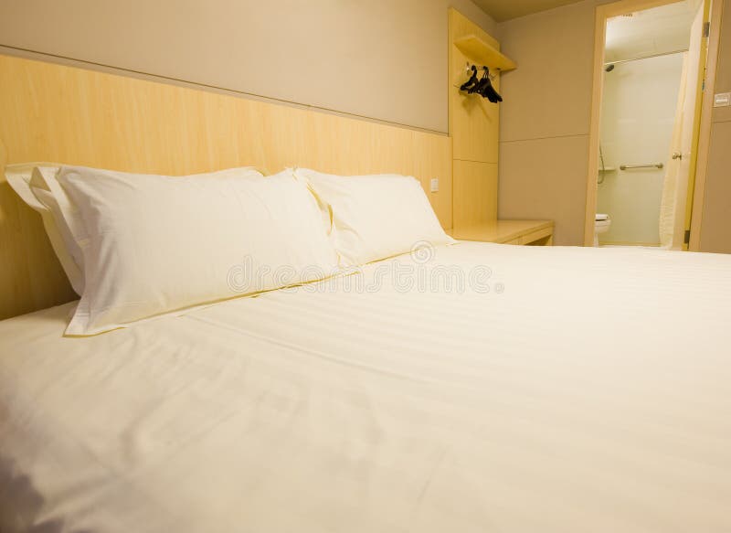 Simple white bed stock image. Image of hanger, cushion - 17293241