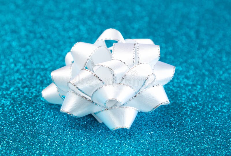 Simple White Bow on a Blue Background Stock Image - Image of holidays ...