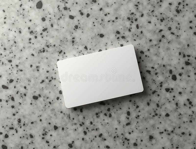 Simple White Card Placed on a Textured Gray Surface in a Modern Setting ...