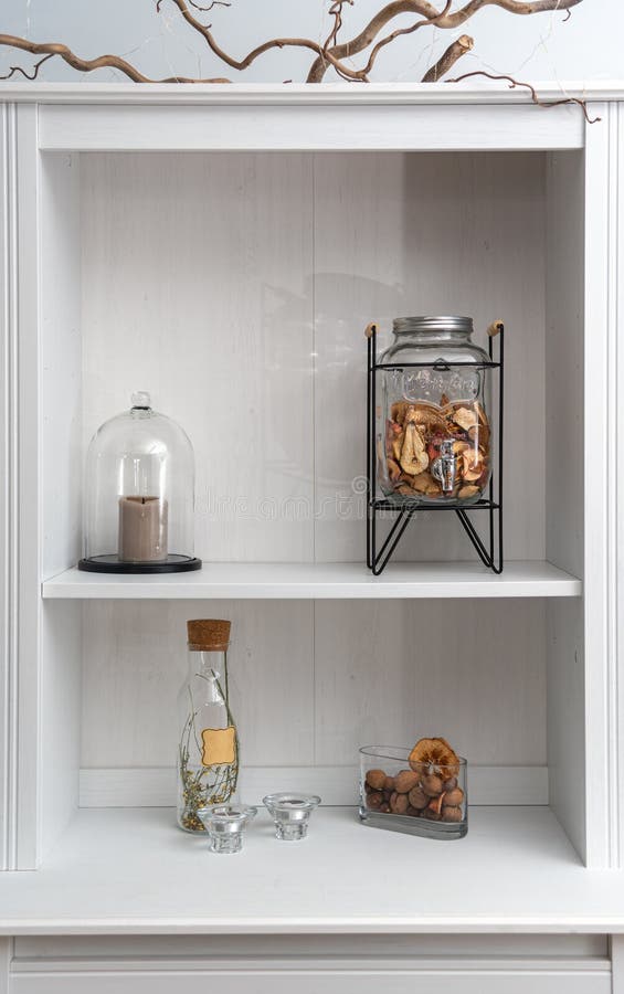 A Simple White Sideboard with Decorative Items on the Shelves Stock ...