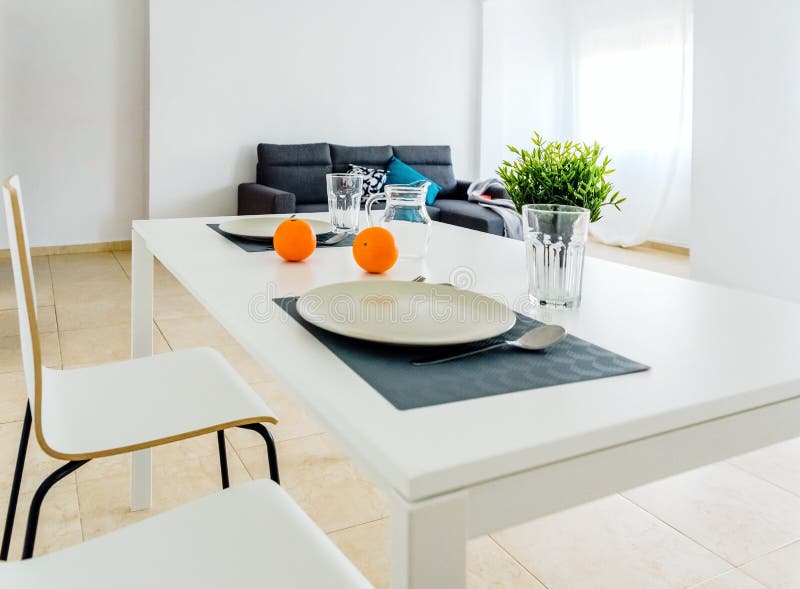 Simple White Table in a Very Simple and Bright Minimalist Living Room ... Simple White Table in a Very Simple and Bright Minimalist Living Room ...