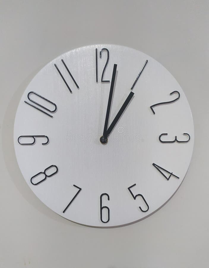 Simple White Themed Wall Clock Stock Photo - Image of white, wall ...