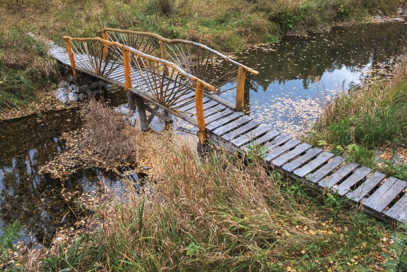 A Simple Wooden Bridge on a Forest River Stock Photo - Image of leaf ...