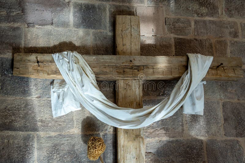 Simple Wooden Cross Adorned with a White Cloth in a Stone Chapel Stock ...
