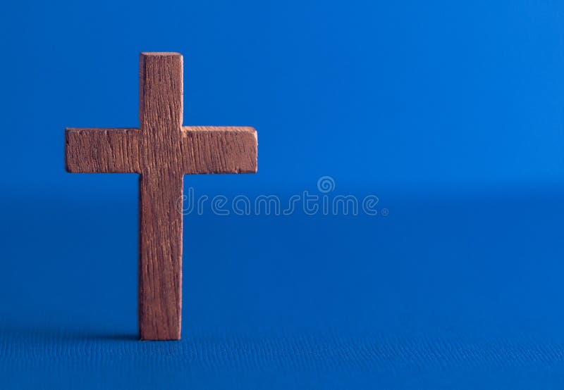 Simple Wooden Cross on a Blue Background Stock Photo - Image of symbols ...