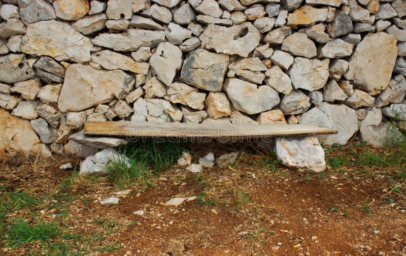 Simple Wooden Seat with Stone Wall Stock Photo - Image of primitive ...