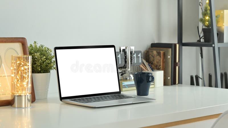 Simple Workplace with Laptop Computer, Coffee Cup, Potted Plant and ...