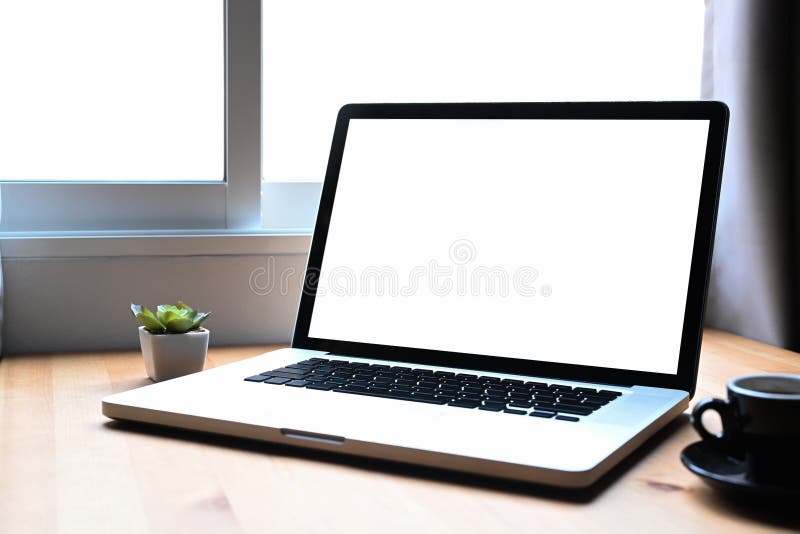 Simple Workplace with Laptop, Coffee Cup and Potted Plant on Wooden ...