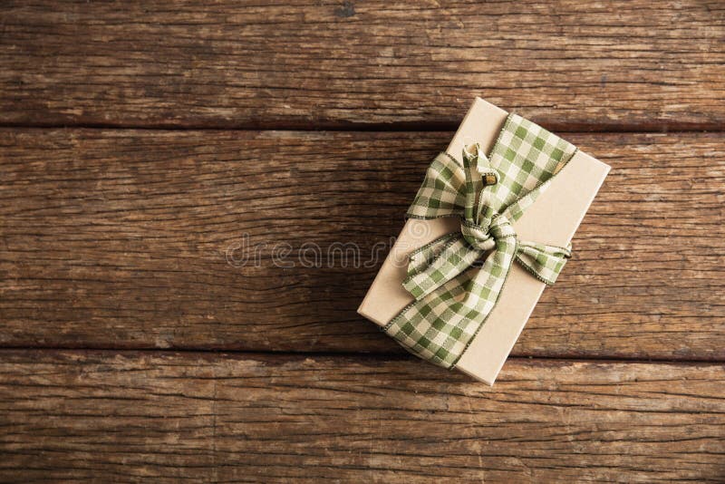 Simple Wrapped Gift on Wooden Table Stock Image - Image of christmas ...