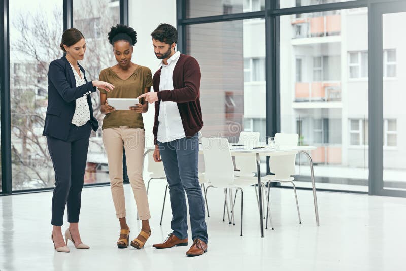 Simplifying Their Tasks with Technology. a Group of Colleagues Working ...