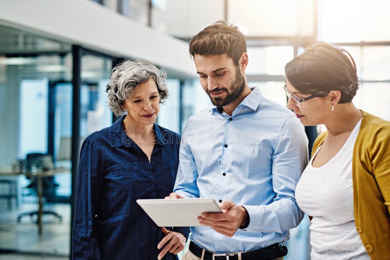 Simplifying Their Tasks with Technology. a Group of Creatives Working ...