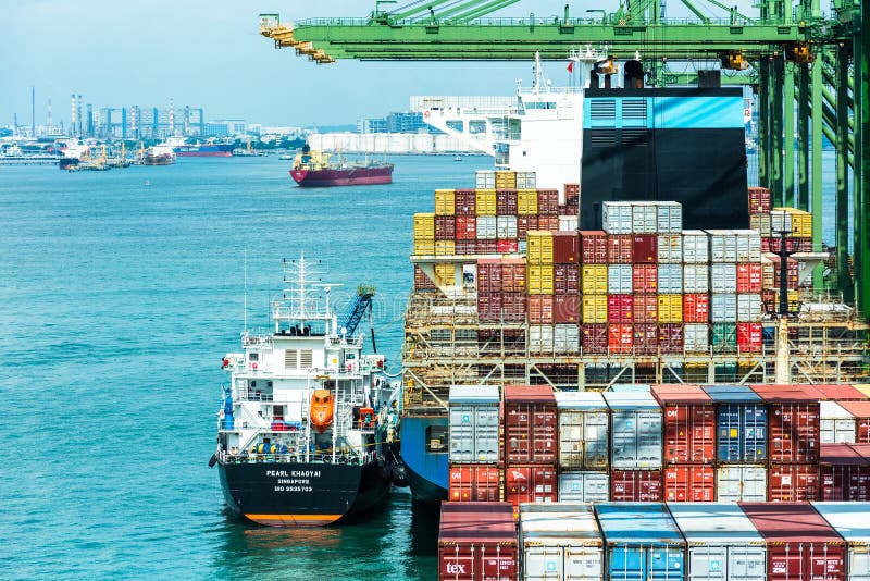 Large Container Ship with Cargo in the Containers Berthed Under Gantry ...