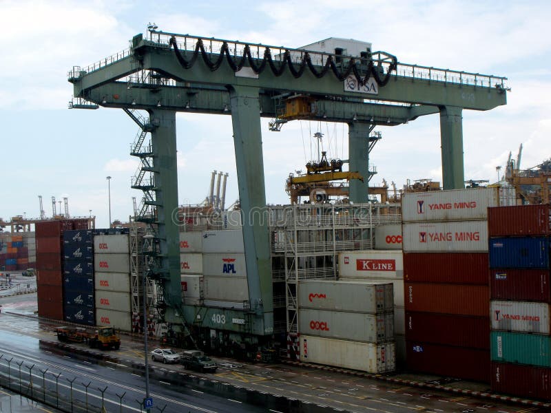 Containers Stacked Next To a Container Loading and Unloading Crane at ...
