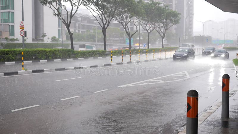 Heavy Rain Pouring on Empty Road in Singapore City Stock Video - Video ...