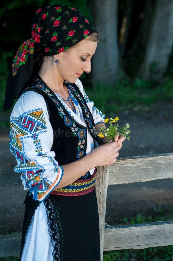 Singer with Flowers in Her Hands Posing at Countryside Stock Image ...