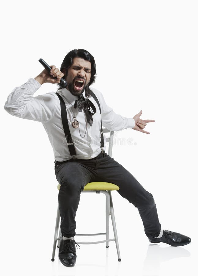 Singer Holding a Mike and Singing Stock Photo - Image of length, singer ...
