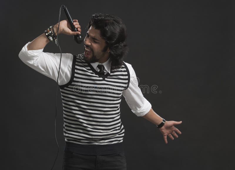Singer Holding a Mike and Singing Stock Image - Image of eyes, closed ...