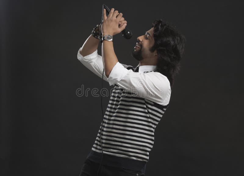 Singer Holding a Mike and Singing Stock Image - Image of 2024, singer ...