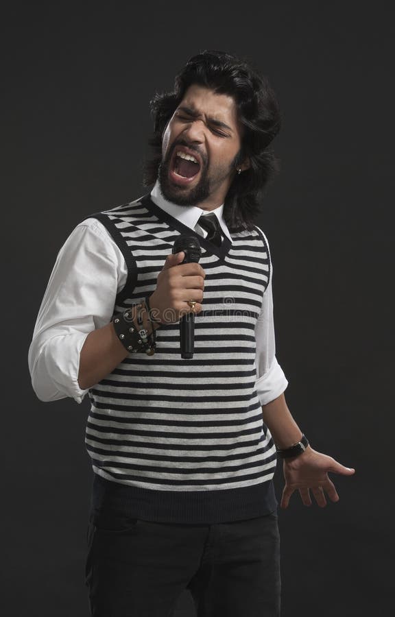 Singer Holding a Mike and Singing Stock Photo - Image of length, singer ...