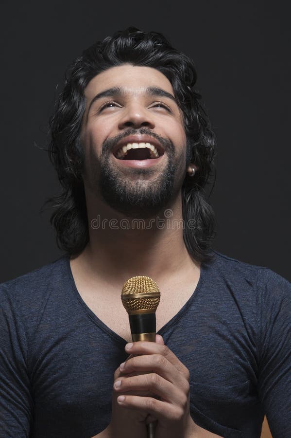 Singer Holding a Mike and Singing Stock Image - Image of 2024, singer ...