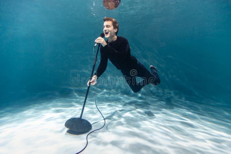 Singer Man with Microphone Underwater. Copy Space. Art Stock Photo ...