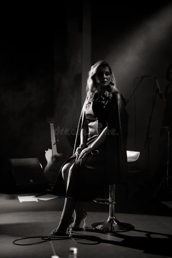 Cool Singer with Microphone on Bright Backlit Stage in Bright Blue ...