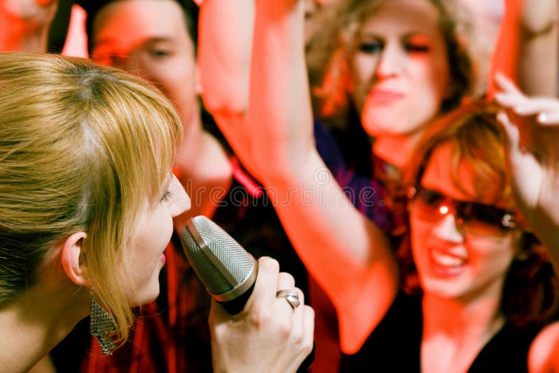 Singer Performing in Front of Crowd Stock Image - Image of play, people ...