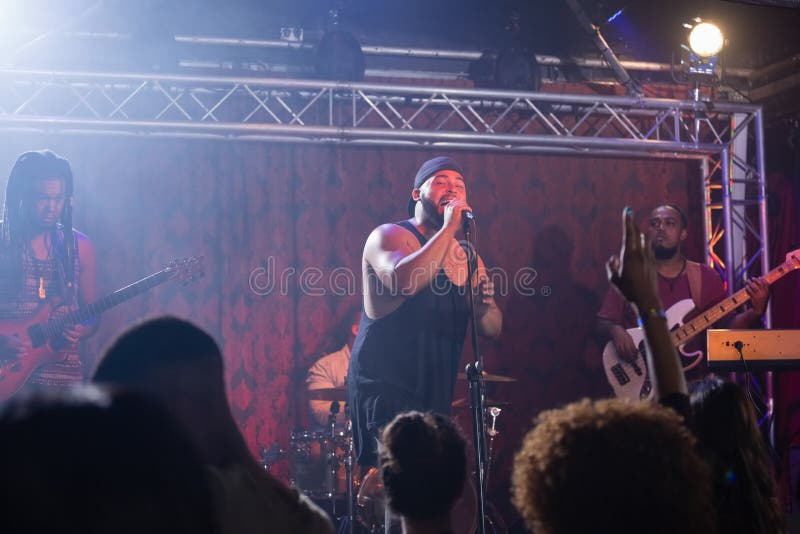 Singer performing on stage stock photo. Image of male - 93236056