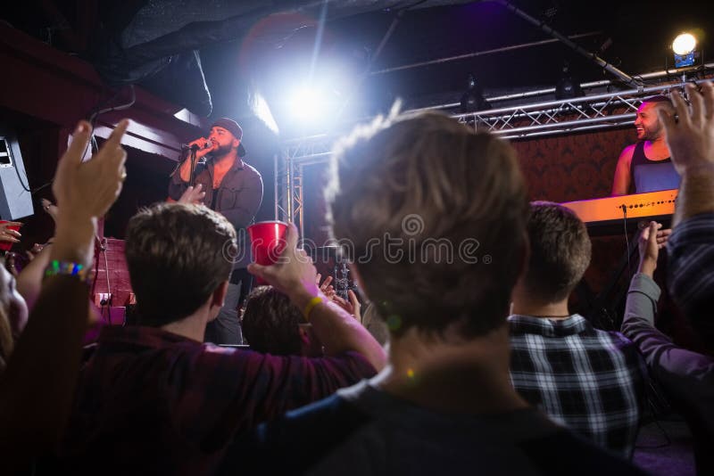 Singer performing on stage stock photo. Image of event - 93236180